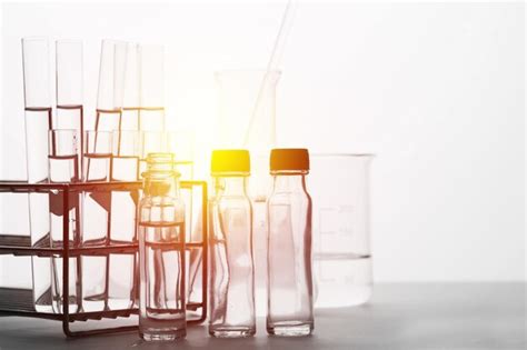 Premium Photo Close Up Of Bottles With Test Tubes On Table