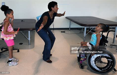 Physical Therapist Robin Mims Gives Erin A Big Hug As Her Sister News Photo Getty Images