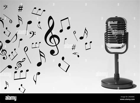 music notes and other musical symbols flowing from retro microphone on