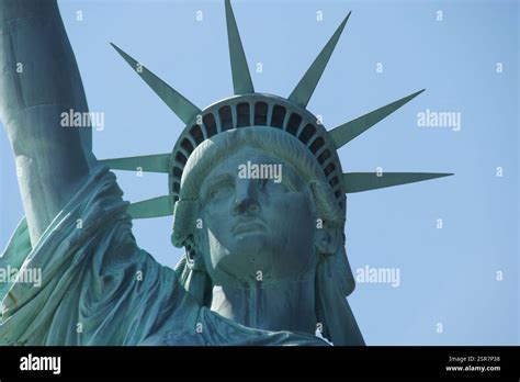 A Close Up Of The Statue Of Libertys Copper Crown With Sun Rays