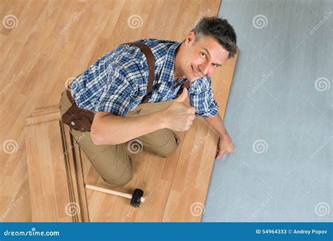 Happy Worker Assembling New Laminate Floor Stock Image Image Of