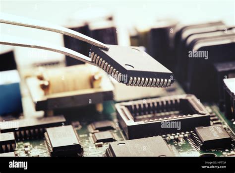 Technician Inserting Electronic Chip Into The Socket Stock Photo Alamy
