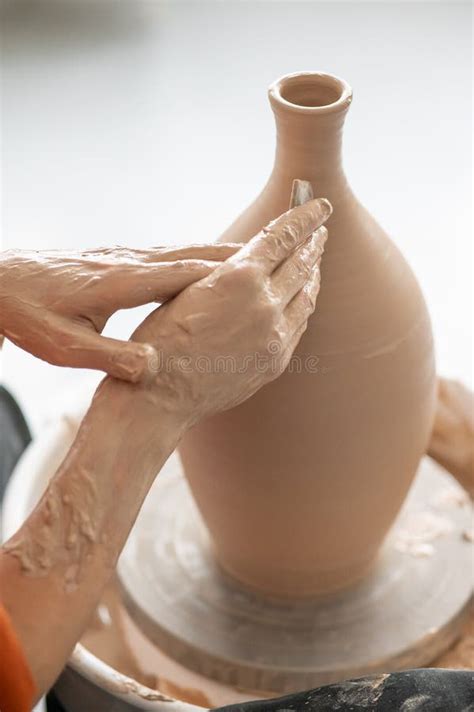 A Potter Works With A Tool On A Potterand X27s Wheel Close Up Of A Man