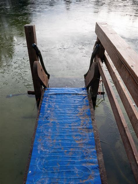 Swimming Pool Hand Rails And Ladder Leading Into Freezing Pond Finland