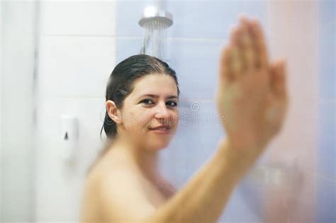 Young Happy Woman Taking Hot Shower At Home Or Hotel Bathroom