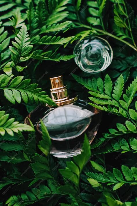 Premium Photo | Perfume bottle with aromatic tropical scent in nature ...