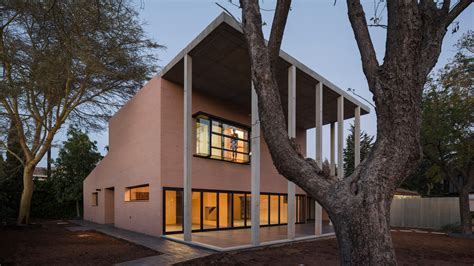 Concrete Portico Provides Shelter At Pink Brick House In Seville