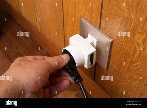 Remove The Plug From The Socket To Save Energy Stock Photo Alamy