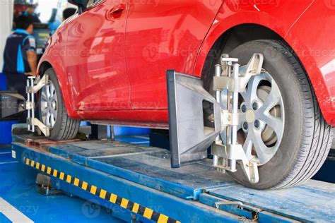 Car wheel alignment in progress at auto repair service centre 12567080 Stock Photo at Vecteezy