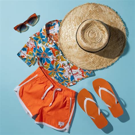 Floating Summer Essentials Against Light Blue Background Evoking