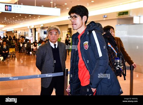 Chinese Football Player Lyu Wenjun Of Shanghai Sipg F C Is Pictured Upon Arrival At The Tokyo