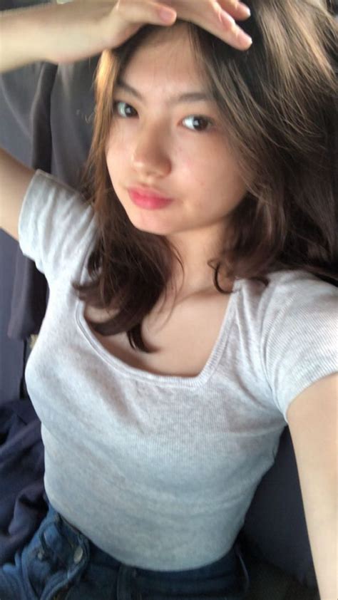 A Woman Sitting Down With Her Hand On Her Head