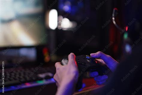 Hand Of Female Cyber Hacker Gamer Holding Controller Joystick To Playing Games On Computer Stock