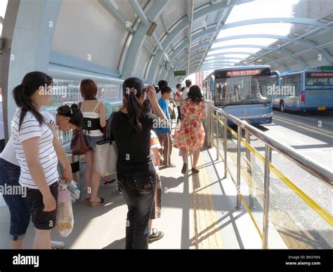 China Locals Taking Suburban Bus In New Overground System In Xiamen In