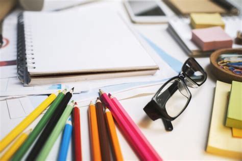 Premium Photo Workplace With Glasses And Supplies