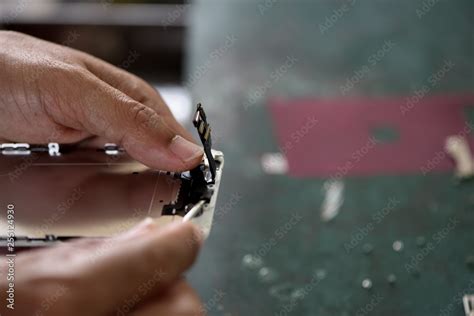 Technician Repairing Broken Mobile Phone Repair With A Mobile Phone Internal Circuit Breaker And