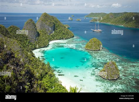 Scenic View Of Wayag Islands And Sailing Boat Lamima Raja Ampat