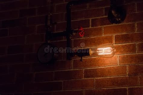 An Incandescent Lamp In A Dim Room Stock Photo Image Of Power Orange 128966178