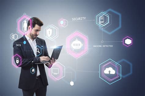 Businessman Using Laptop With Floating Holographic Icons Representing Data Protection And