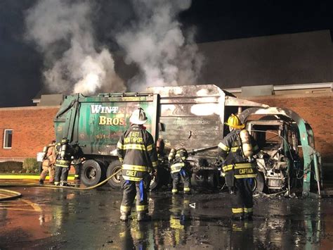 Garbage Truck Engulfed In Flames Near Suffolk Library Photos