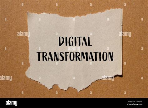 digital transformation message written on ripped paper with cardboard