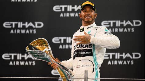 Lewis Hamilton Collects F1 World Championship Trophy