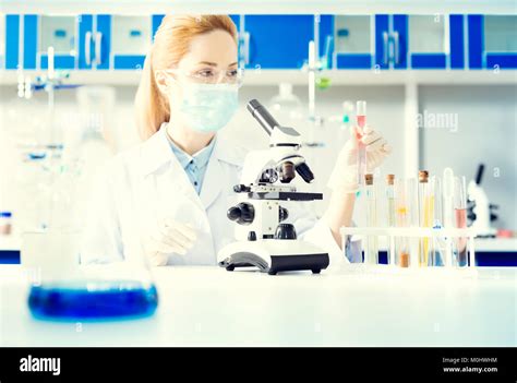 Female Lab Worker Conducting Chemical Experiment Stock Photo Alamy