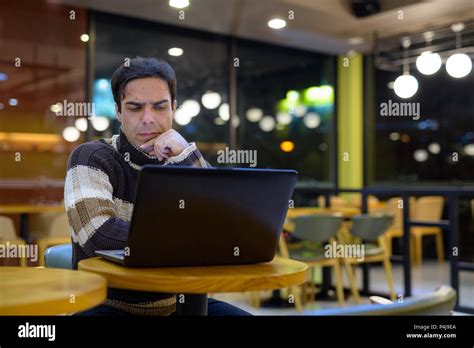 Man Using Laptop Computer While Thinking Stock Photo Alamy