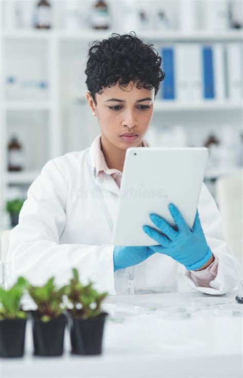 woman scientist and reading on tablet in lab for plant research cell