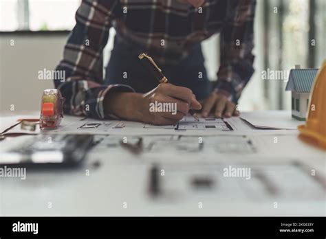 Professional Architect Designer Structural Engineer Working With Blueprint Design Project Stock
