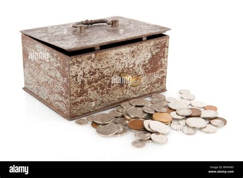 Old rusty money box with golden key and coins Stock Photo - Alamy