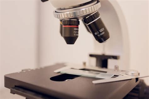Premium Photo Scientist Hands With Microscope Closeup Shot In The