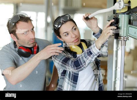 Man And Woman With Machine Cnc Stock Photo Alamy