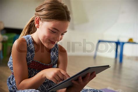 Girl Using Laptop Computer In Playroom Stock Image Colourbox