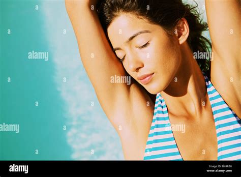 Woman Sunbathing Poolside High Resolution Stock Photography And Images Alamy