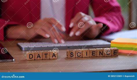 Hands Typing On Computer Keyboard And Data Science Text On Cubes Stock