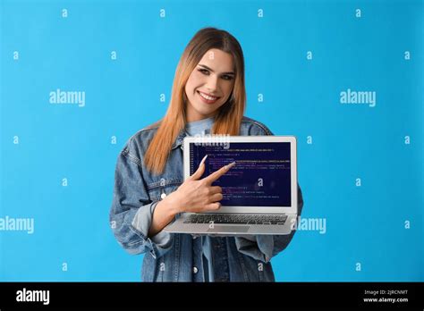 Transgender Programmer With Laptop On Blue Background Stock Photo Alamy