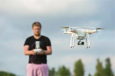 Man Controlling A Drone Stock Photo By Creatista 87605446
