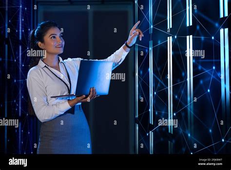 Female Technician Programmer Working On The Server In The Data Storage Room Stock Photo Alamy