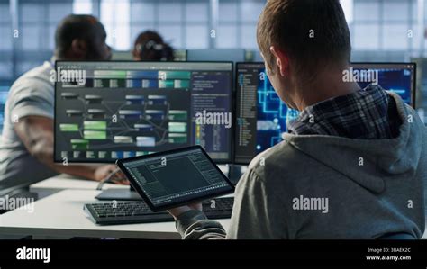 Computer Scientist In Data Center Uses Artificial Intelligence Neural