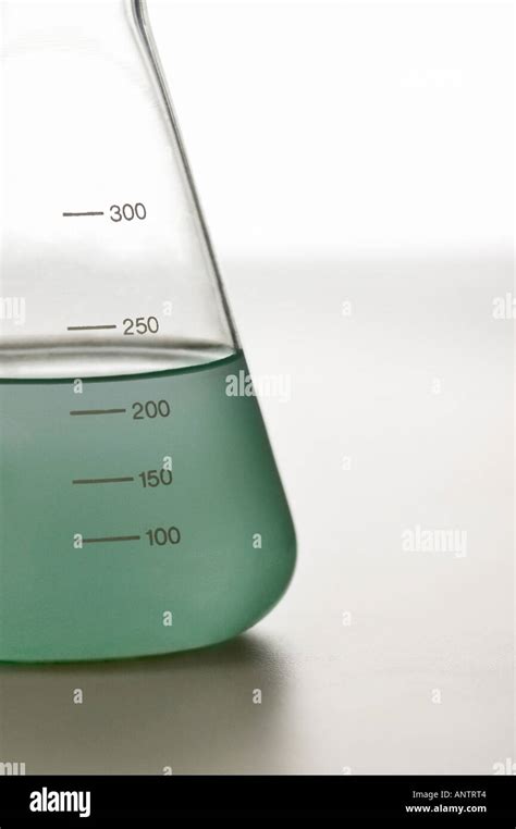CHEMISTRY MEASURING BEAKER WITH GREEN LIQUID INSIDE CLOSE UP PART OF Stock Photo Alamy