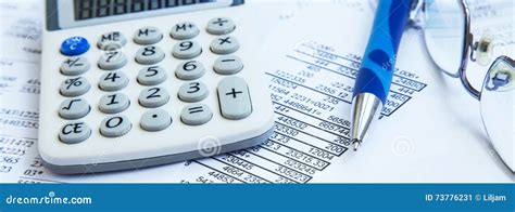 Financial Accounting With Paper Reports And Calculator Stock Image