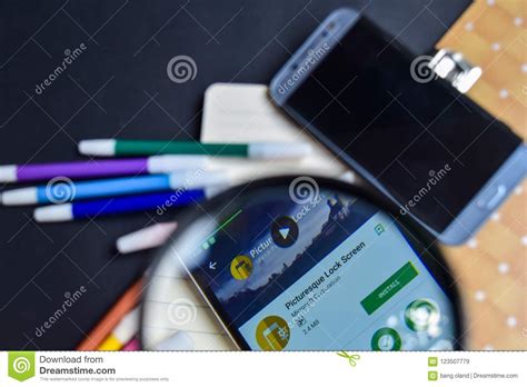 pictures lock screen app with magnifying on smartphone screen editorial stock image image of