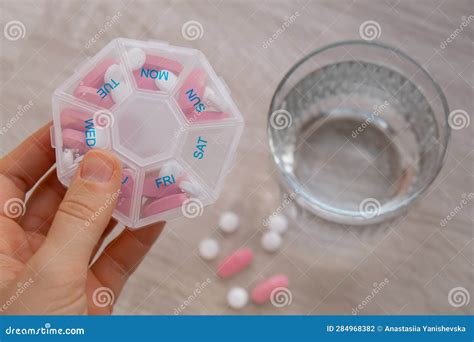 Woman Sorting Pills Organizer Weekly Shots Closeup Of Medical Pill Box With Doses Of Tablets For