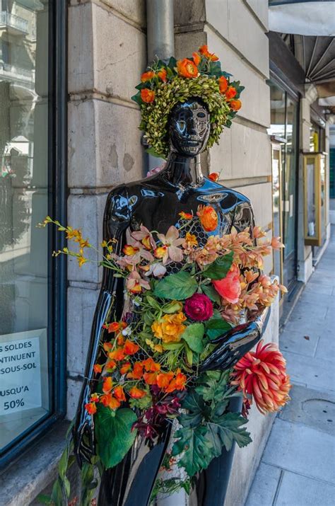 Mannequin Decorated With Floral Motifs In Front Of A Clothing Store In