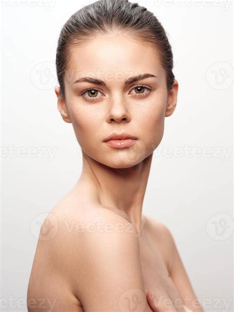 Attractive Young Woman With Bare Chest Posing Elegantly For Camera On