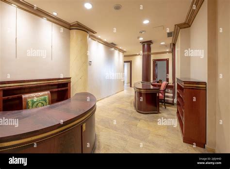 Wooden Counters Of A Professional Office With Marble Floors And