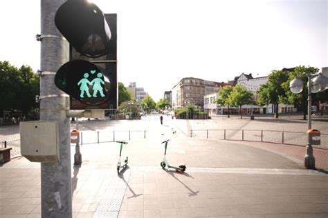 Pedestrian Traffic Light Shows A Green Graphic Of A Symbolic Different Sex Couple In Front Of A