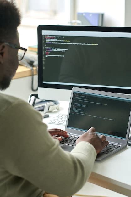 premium photo programmer developing new software on laptop