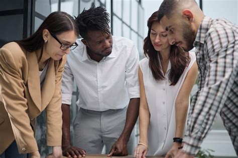 Premium Photo Negotiate Marketing Reports Statistical Charts Work Together On A Startup Project